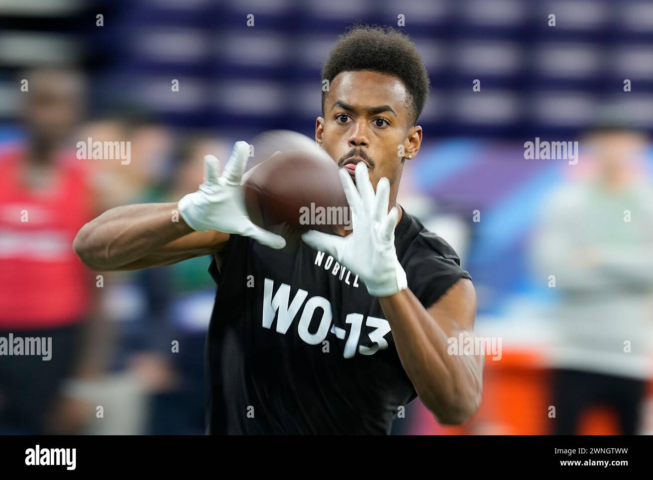 Michigan wide receiver Cornelius Johnson runs a drill at the NFL ...
