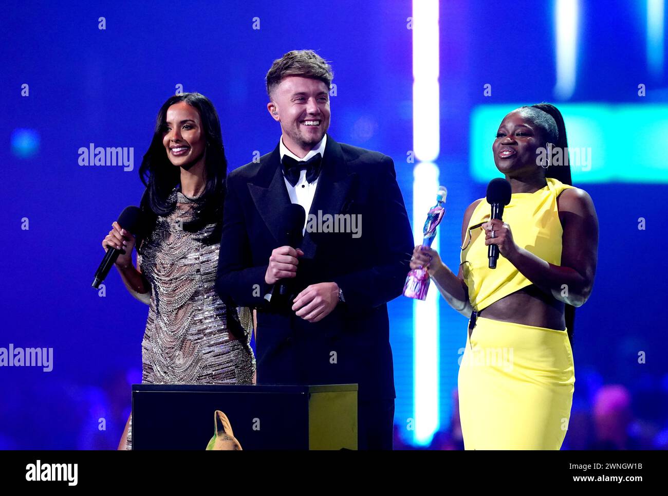 Hosts Maya Jama, Roman Kemp and Clara Amfo on stage during the Brit ...