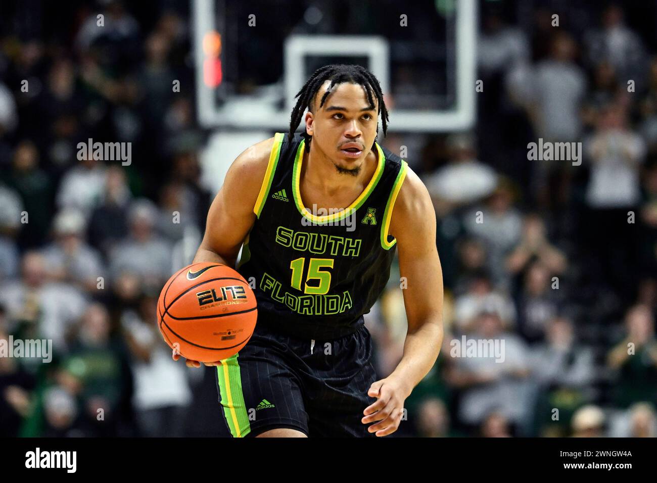 South Florida forward Corey Walker Jr. (15) brings the ball up court ...