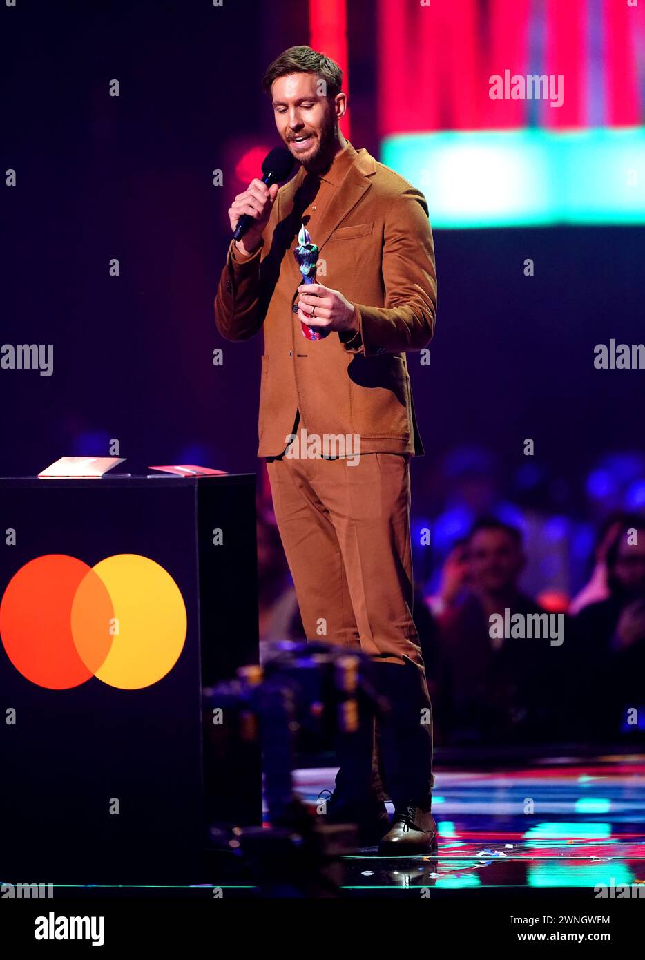 Calvin Harris on stage after winning the award for Best Dance Act ...