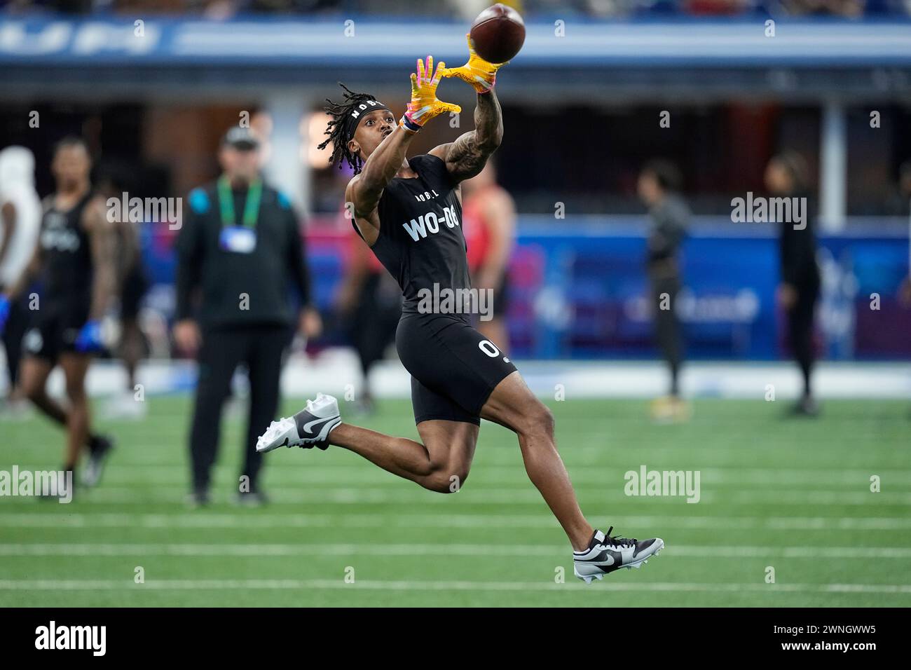 Arizona wide receiver Jacob Cowing runs a drill at the NFL football ...
