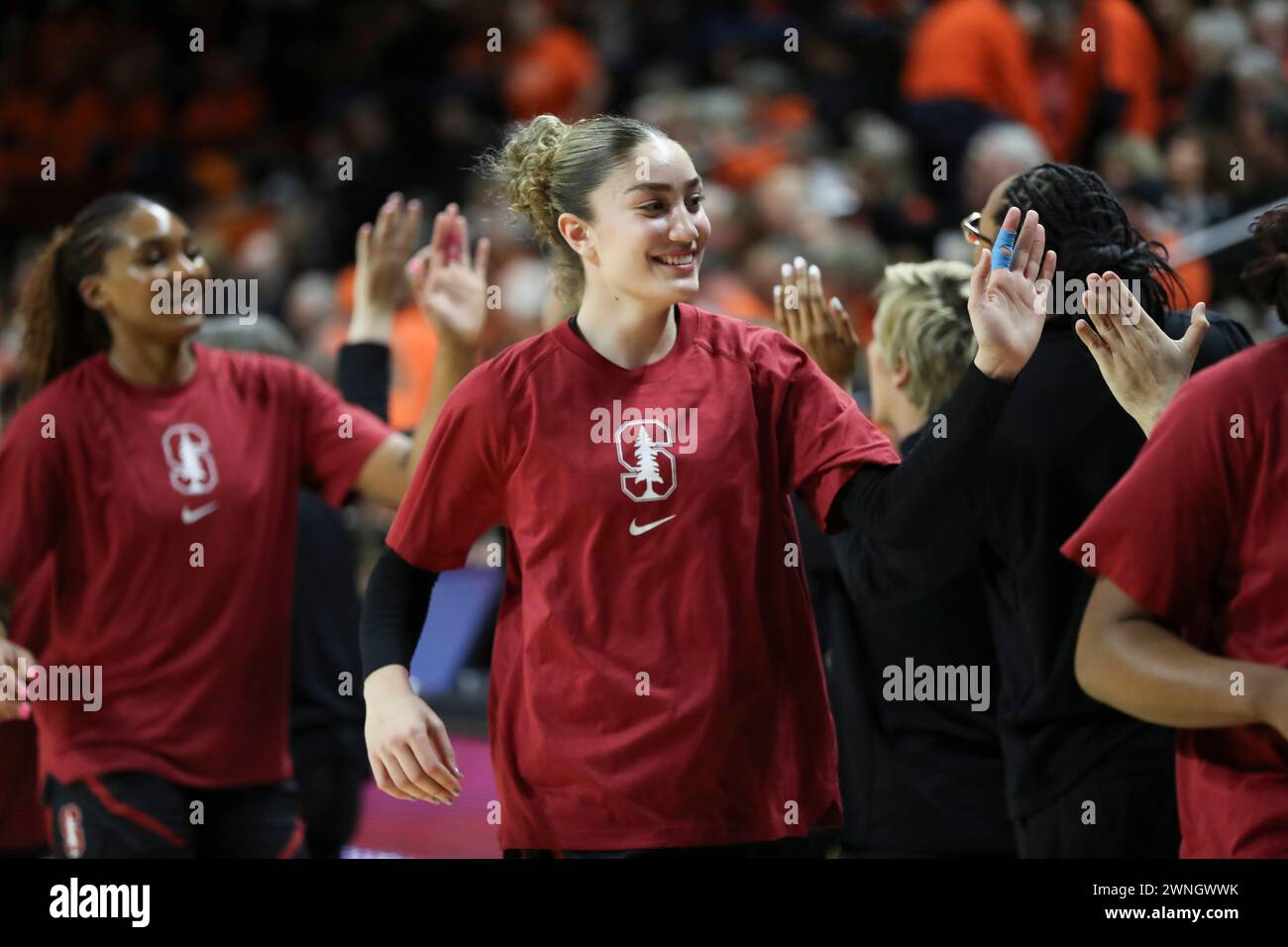 Stanford forward Brooke Demetre (21) high fives teammates before an ...