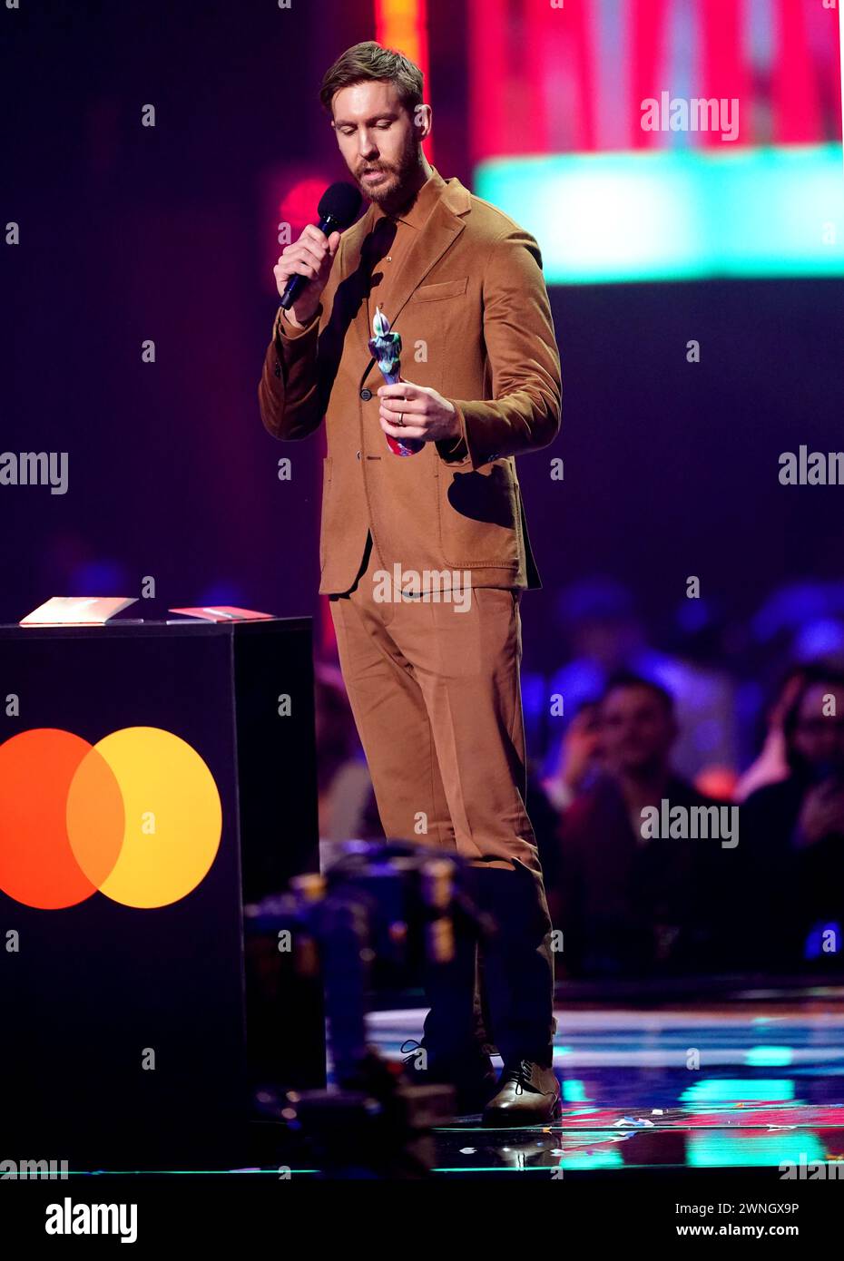 Calvin Harris on stage after winning the award for Best Dance Act ...