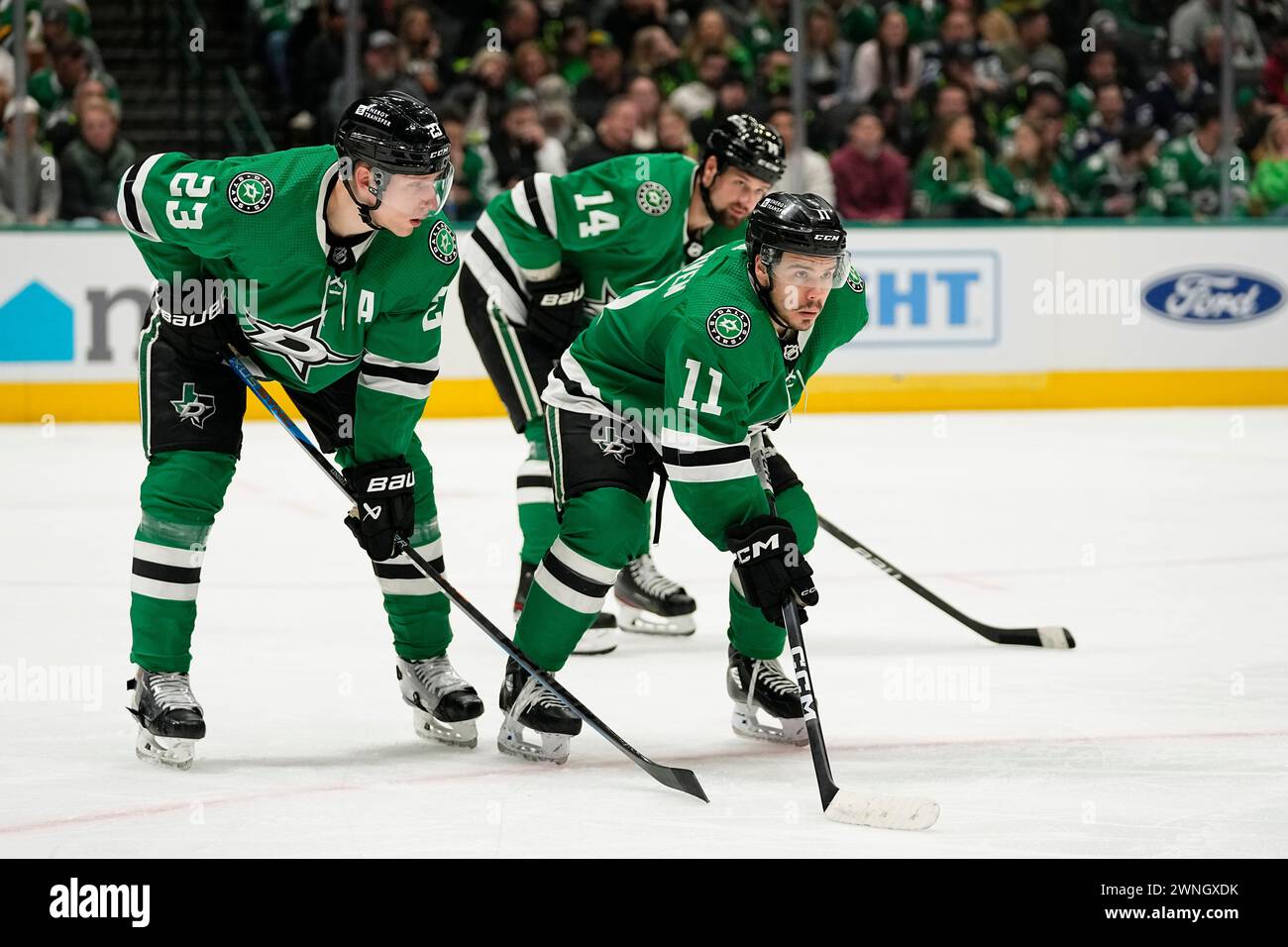 Dallas Stars' Esa Lindell (23), Logan Stankoven (11) and Jamie Benn (14 ...