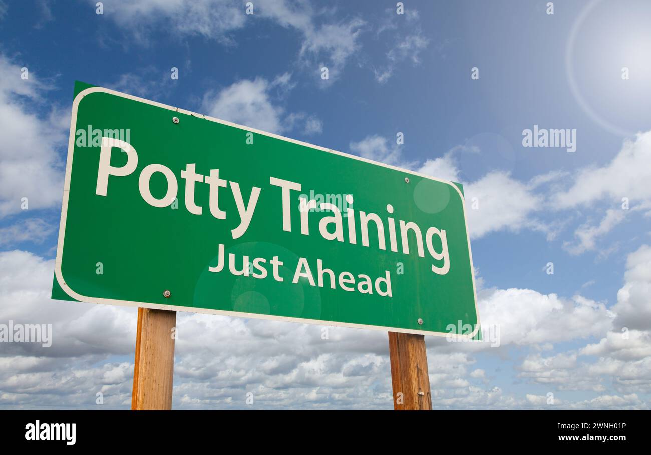 Potty Training Just Ahead Green Road Sign Over Clouds and Blue Sky ...