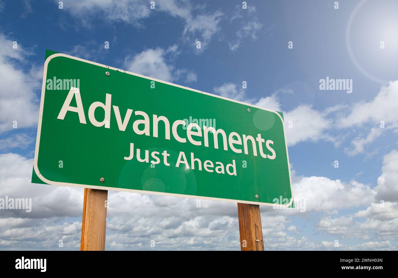 Advancements Just Ahead Green Road Sign Over Clouds and Blue Sky Stock ...