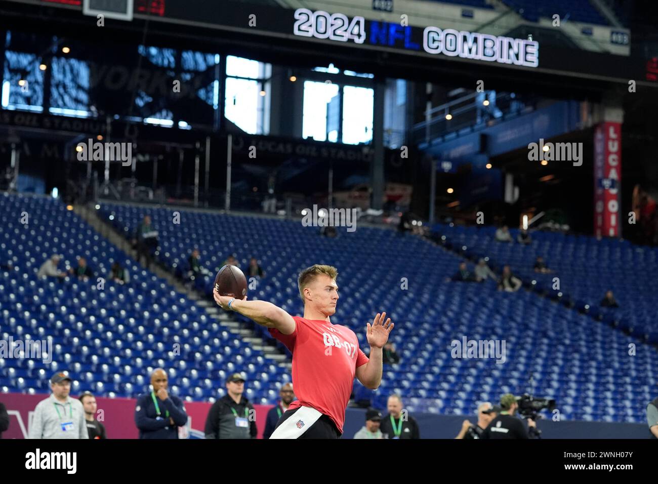 Oregon quarterback Bo Nix runs a drill at the NFL football scouting ...