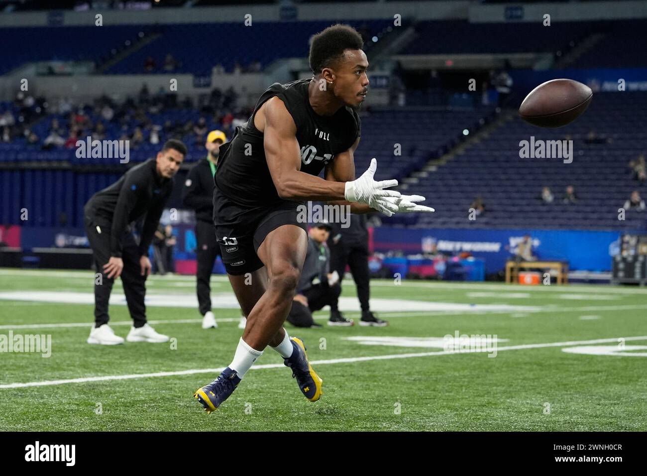 Michigan wide receiver Cornelius Johnson runs a drill at the NFL ...