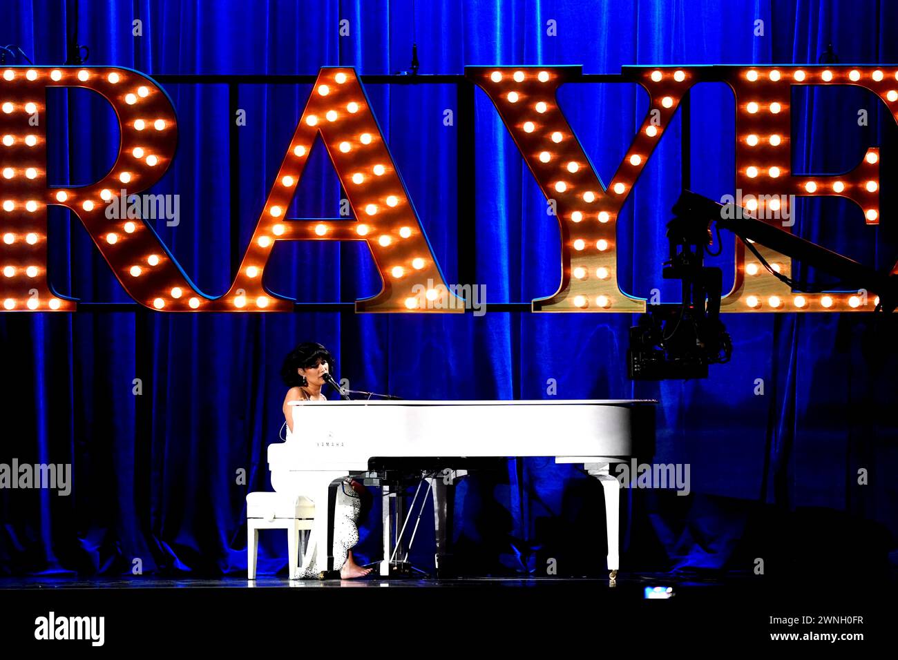 Raye performing on stage during the Brit Awards 2024 at the O2 Arena, London. Picture date ...