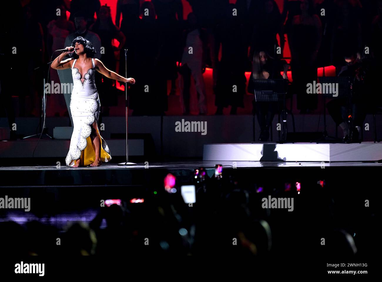 Raye performing on stage during the Brit Awards 2024 at the O2 Arena ...