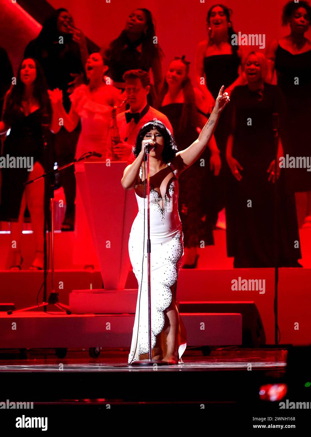 Raye performing on stage during the Brit Awards 2024 at the O2 Arena ...
