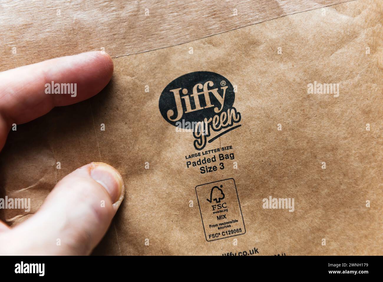 Bremen, Germany Dec 10, 2023: From a male hand's perspective, holding a ...