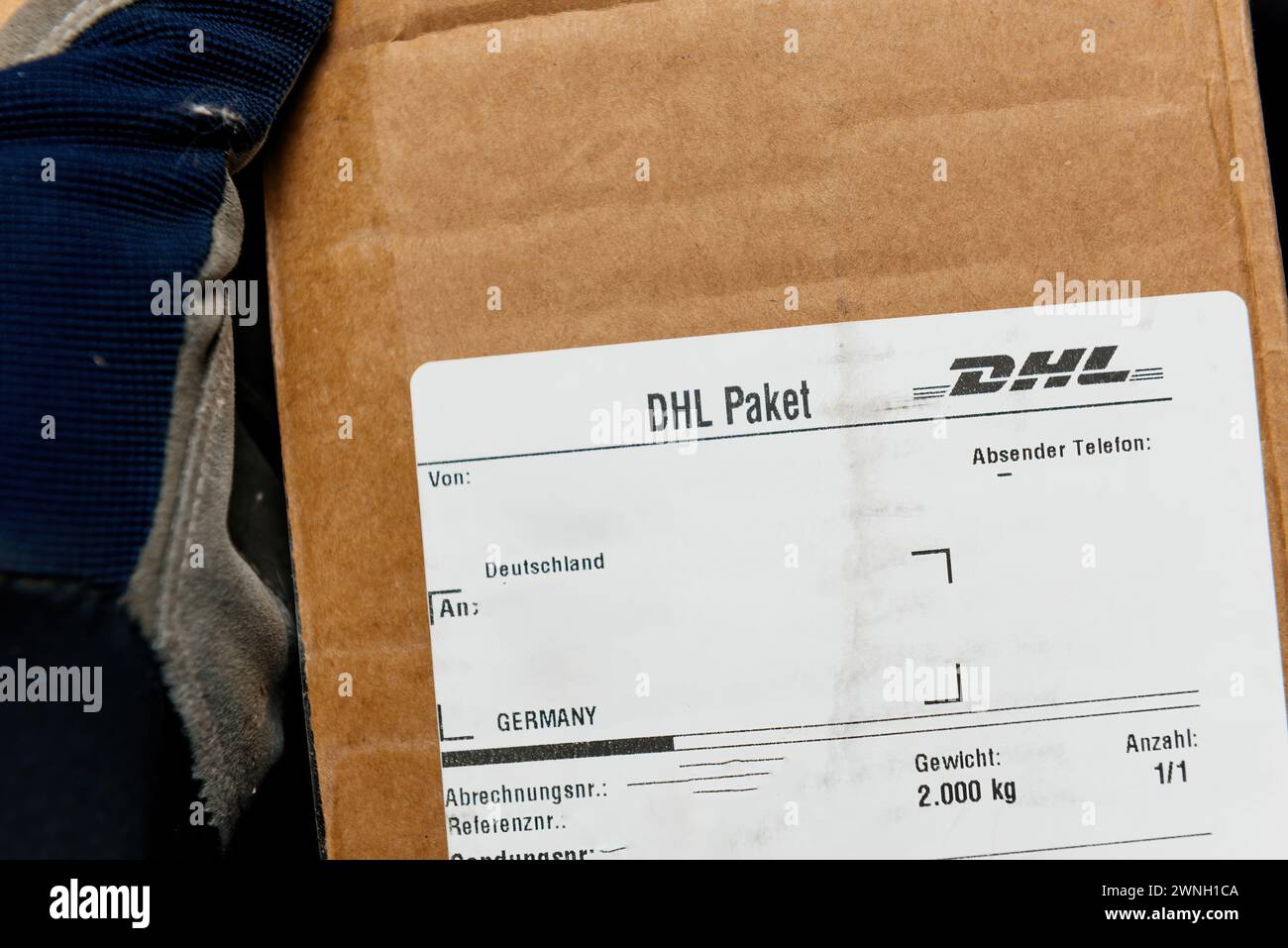 Bremen, Germany - Dec 10, 2023: A DHL packet sticker displays the ...