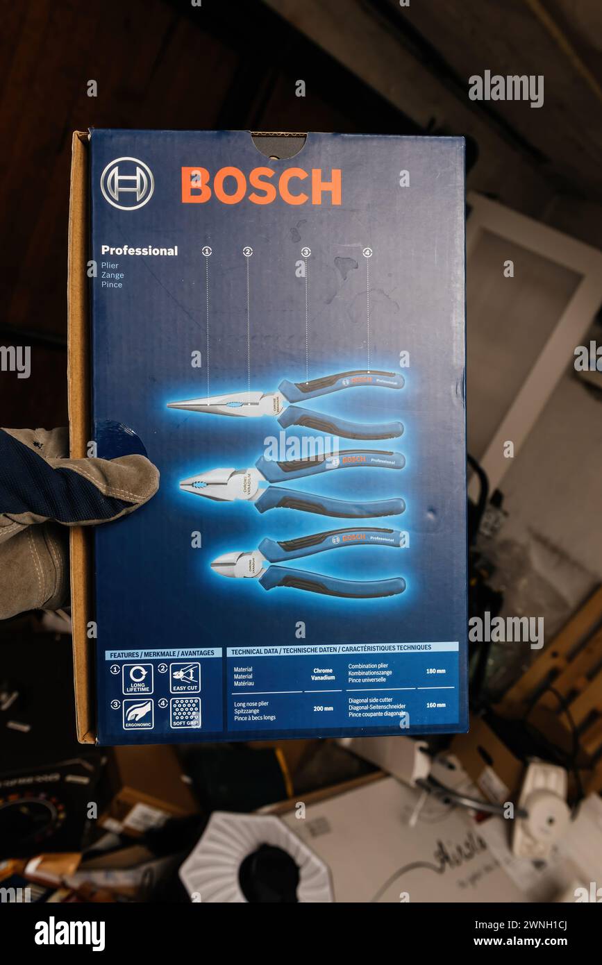 Bremen, Germany - Dec 10, 2023: A male hand holds a Bosch Professional ...