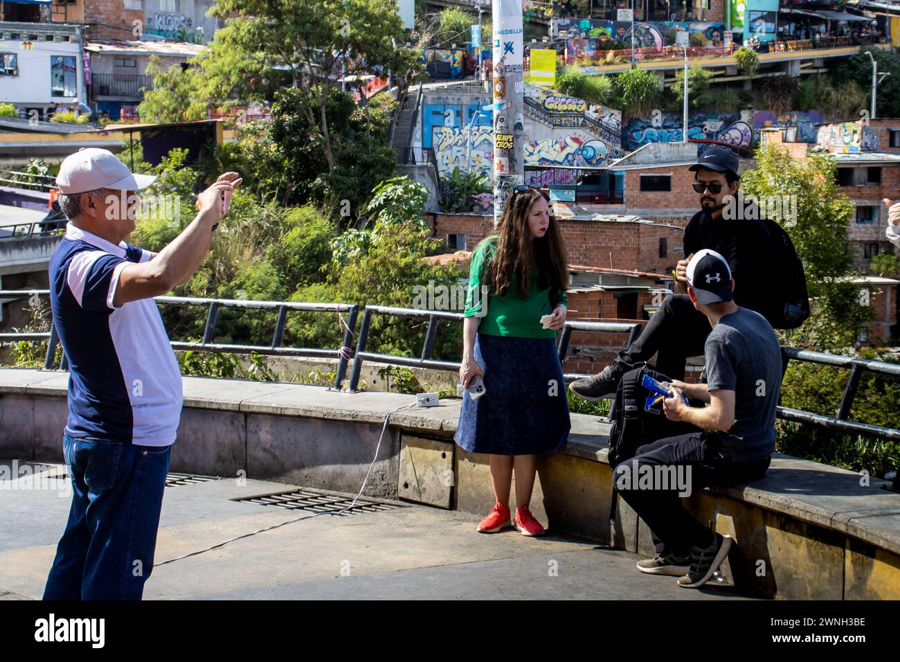 MEDELLIN, COLOMBIA - JANUARY 17, 2024: Tourists at the famous Comuna 13 ...