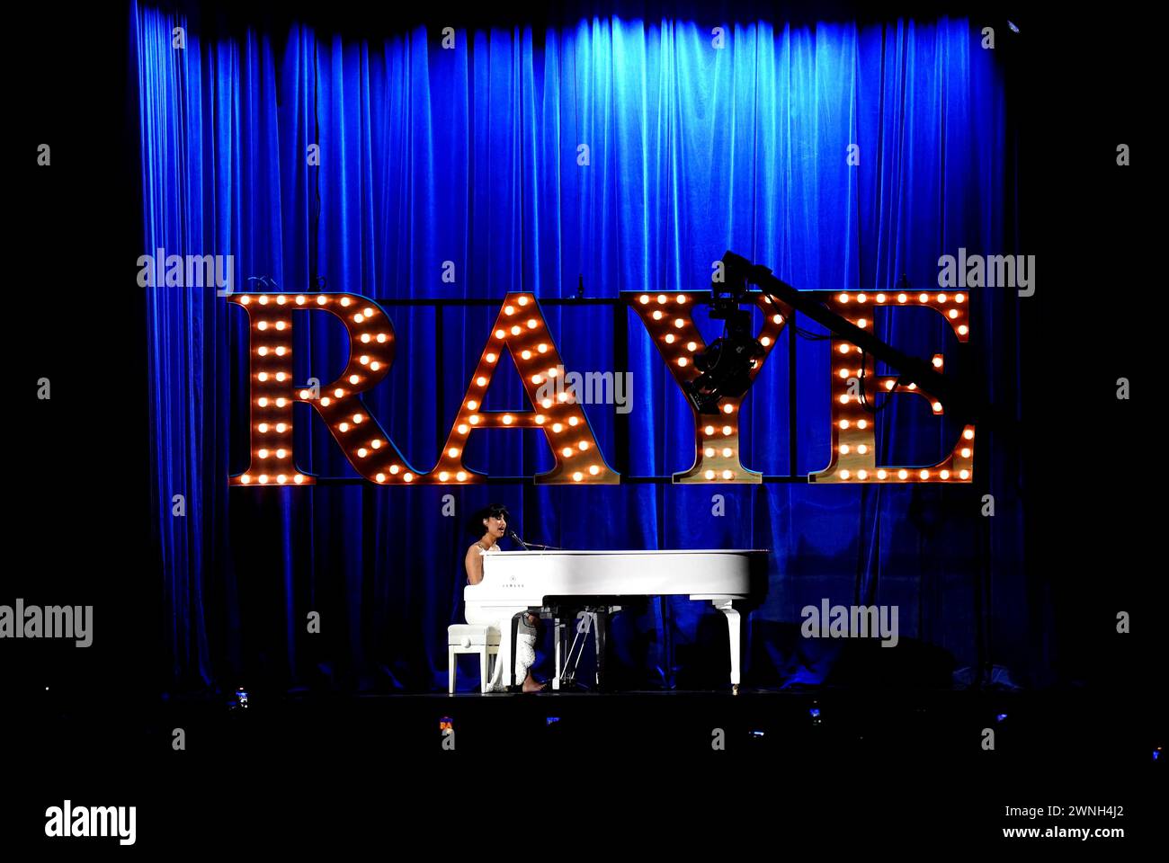 Raye performing on stage during the Brit Awards 2024 at the O2 Arena ...