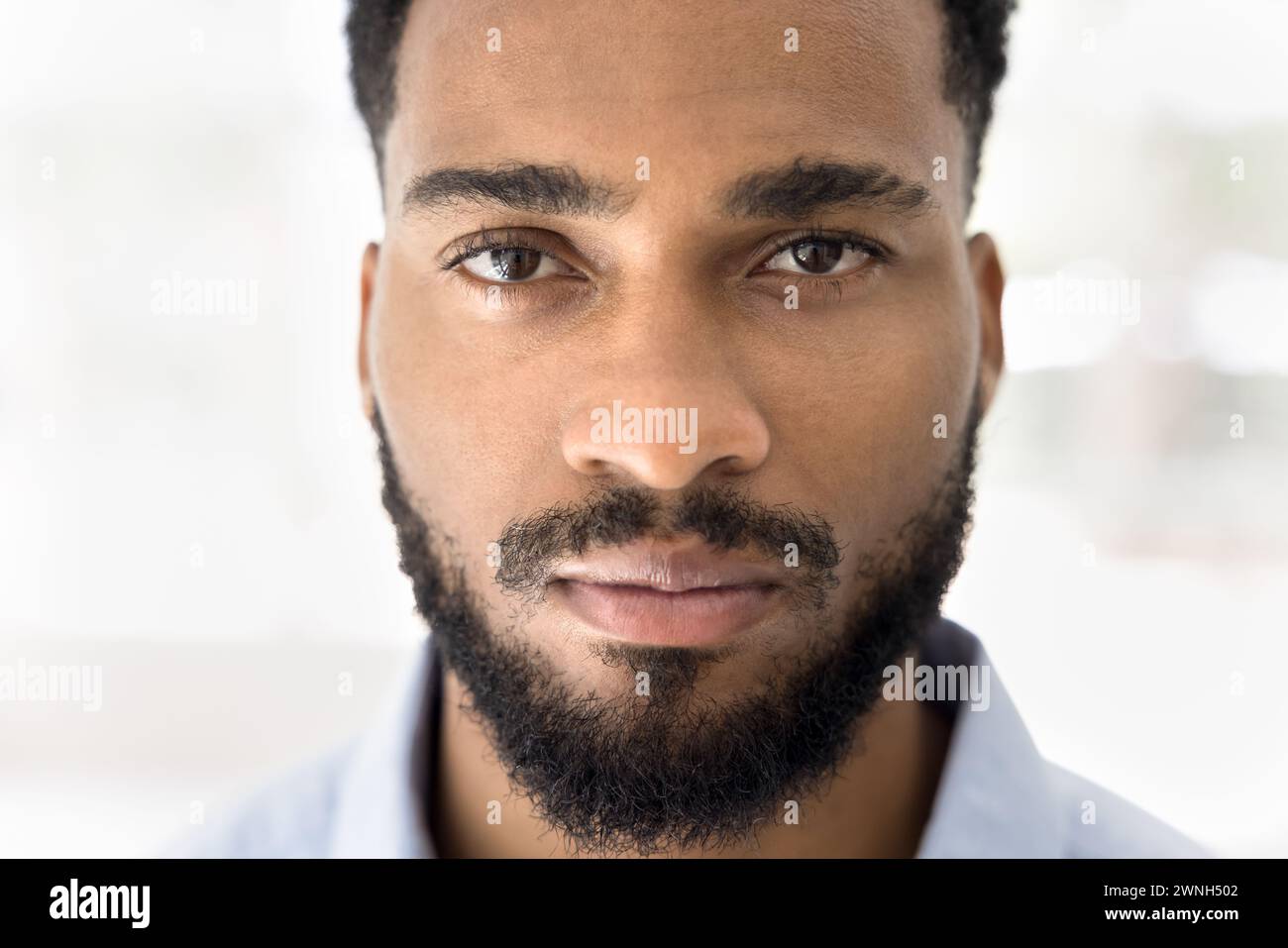 Serious african man looking camera hi-res stock photography and images ...