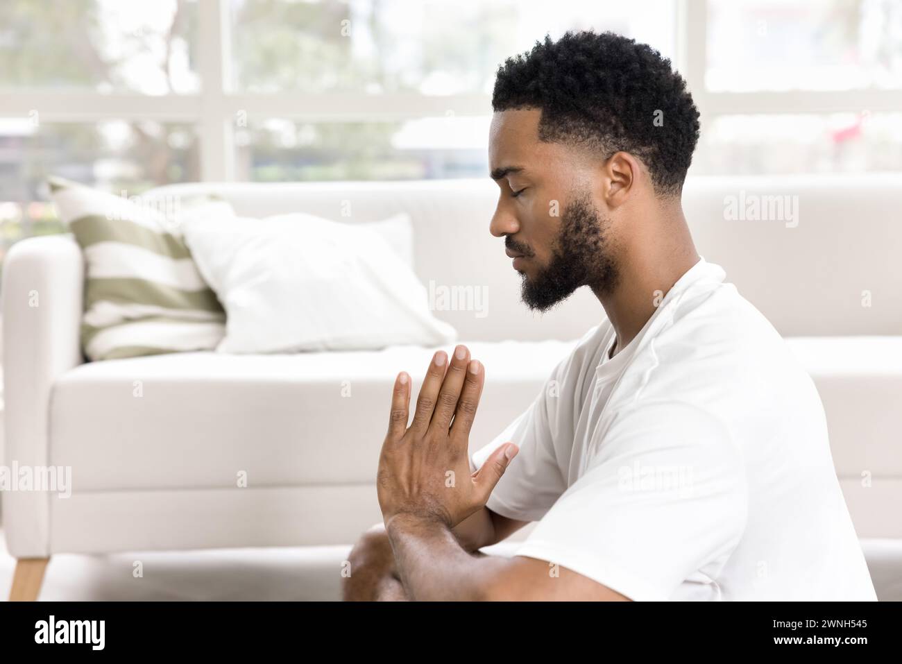 African man meditating close hi-res stock photography and images - Alamy