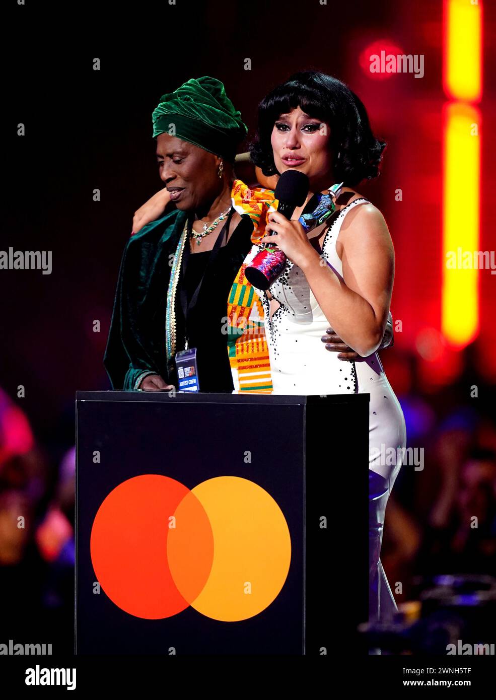 Raye (right) on stage with her grandmother after winning the Mastercard ...