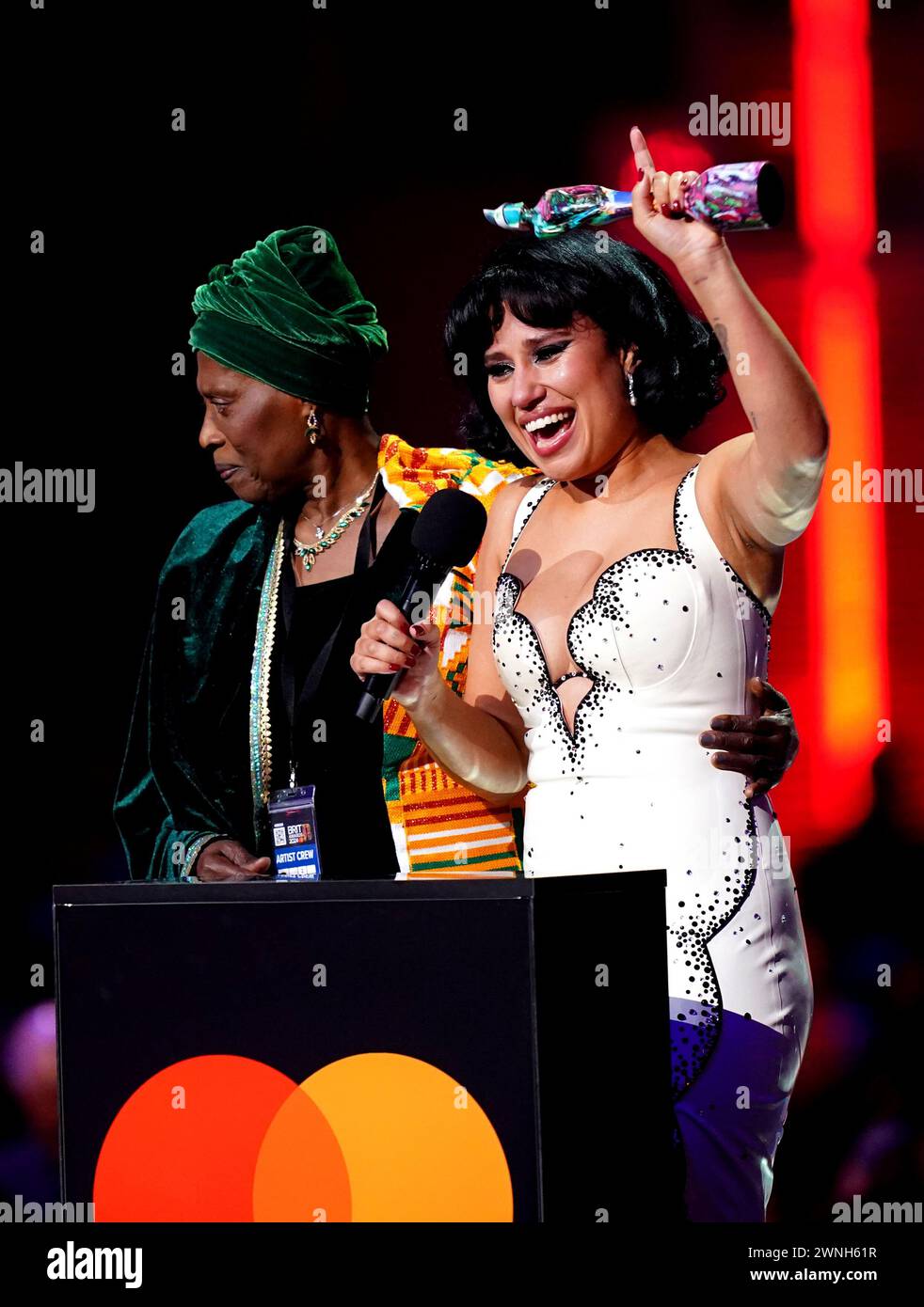 Raye (right) on stage with her grandmother after winning the Mastercard ...