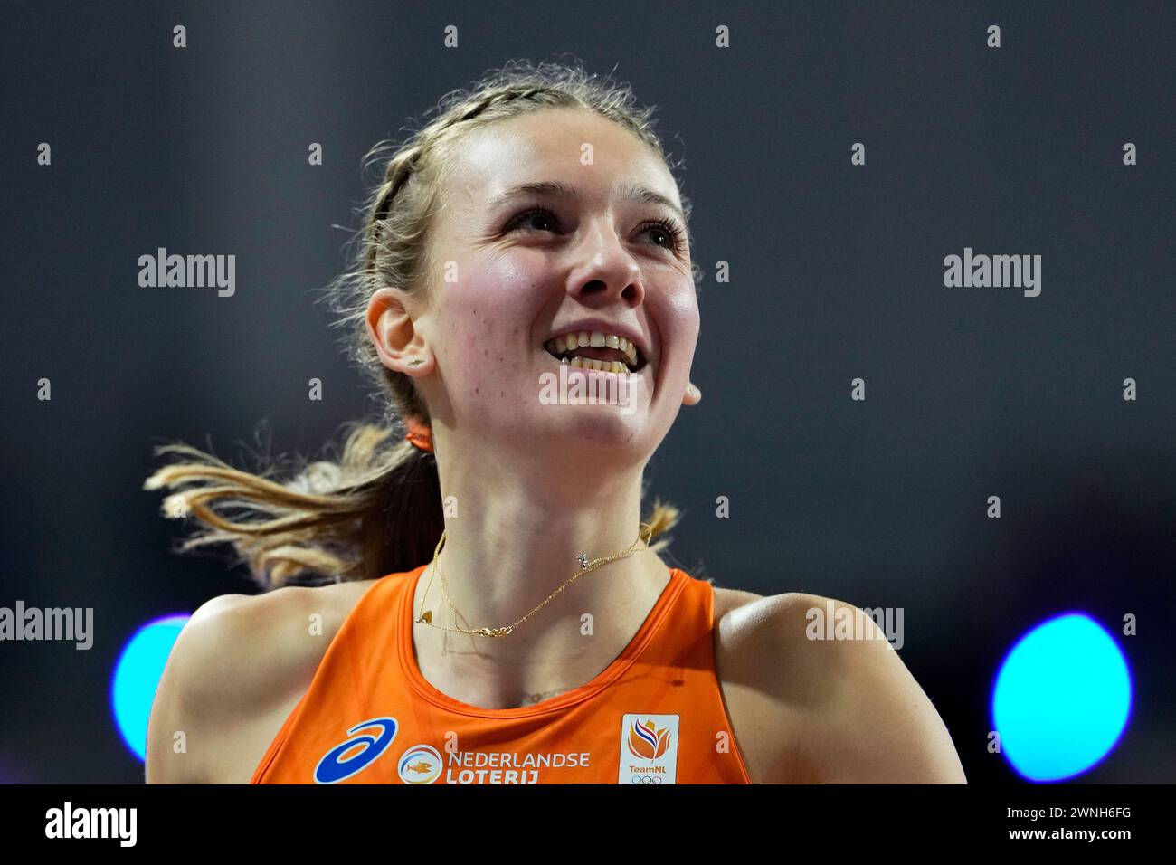 Femke Bol, of the Netherlands, crosses the finish line to win the gold ...