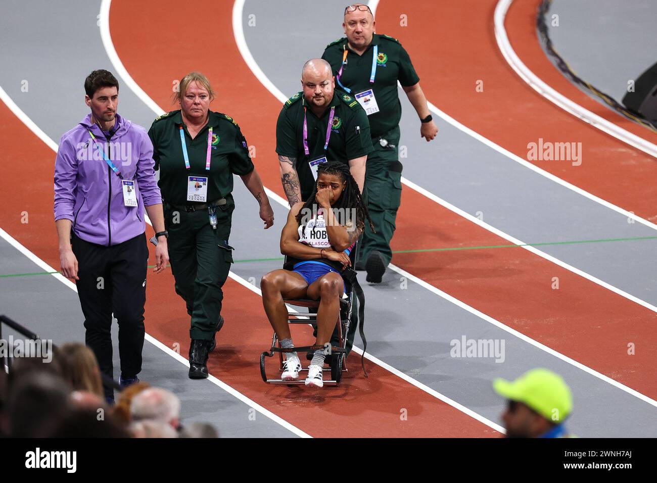 Aleia Hobbs (USA, 60 Metres) is taken away in a wheelchair before the ...