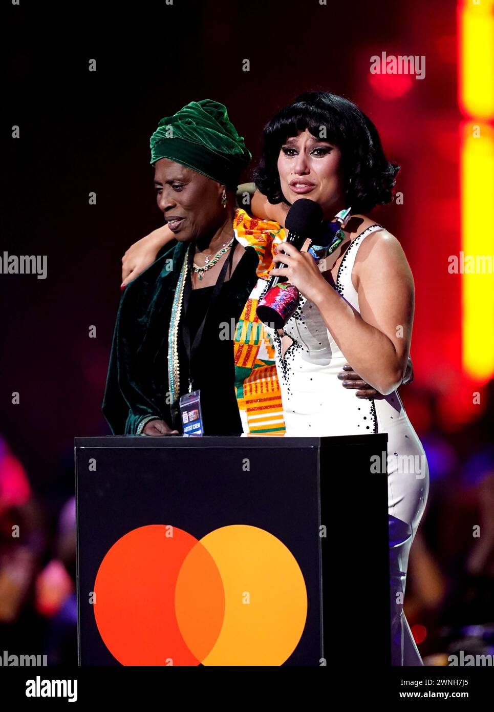 Raye (right) on stage with her grandmother after winning the Mastercard ... Raye (right) on stage with her grandmother after winning the Mastercard ...