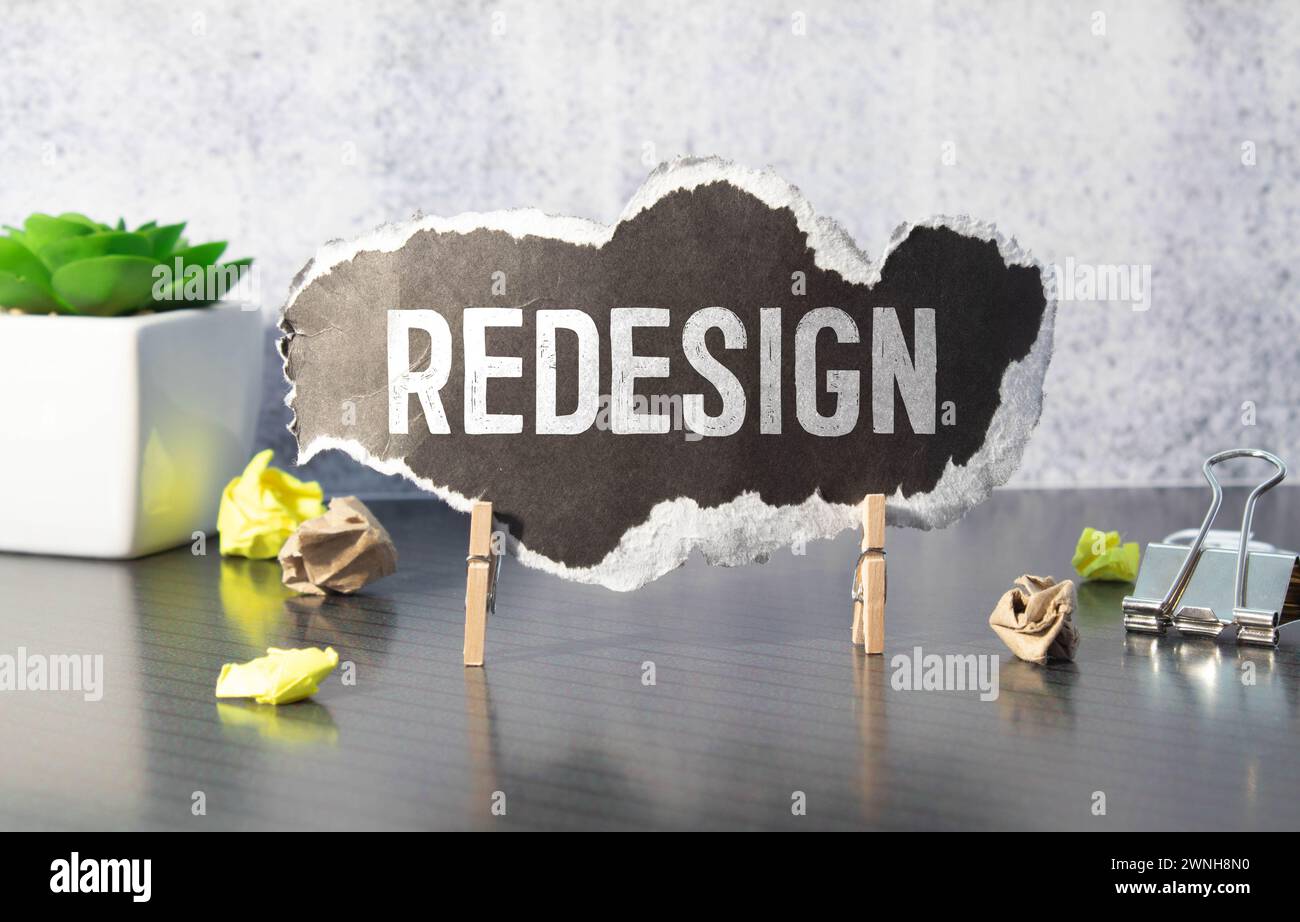 REDESIGN word written on wood block. REDESIGN text on wooden table for ...