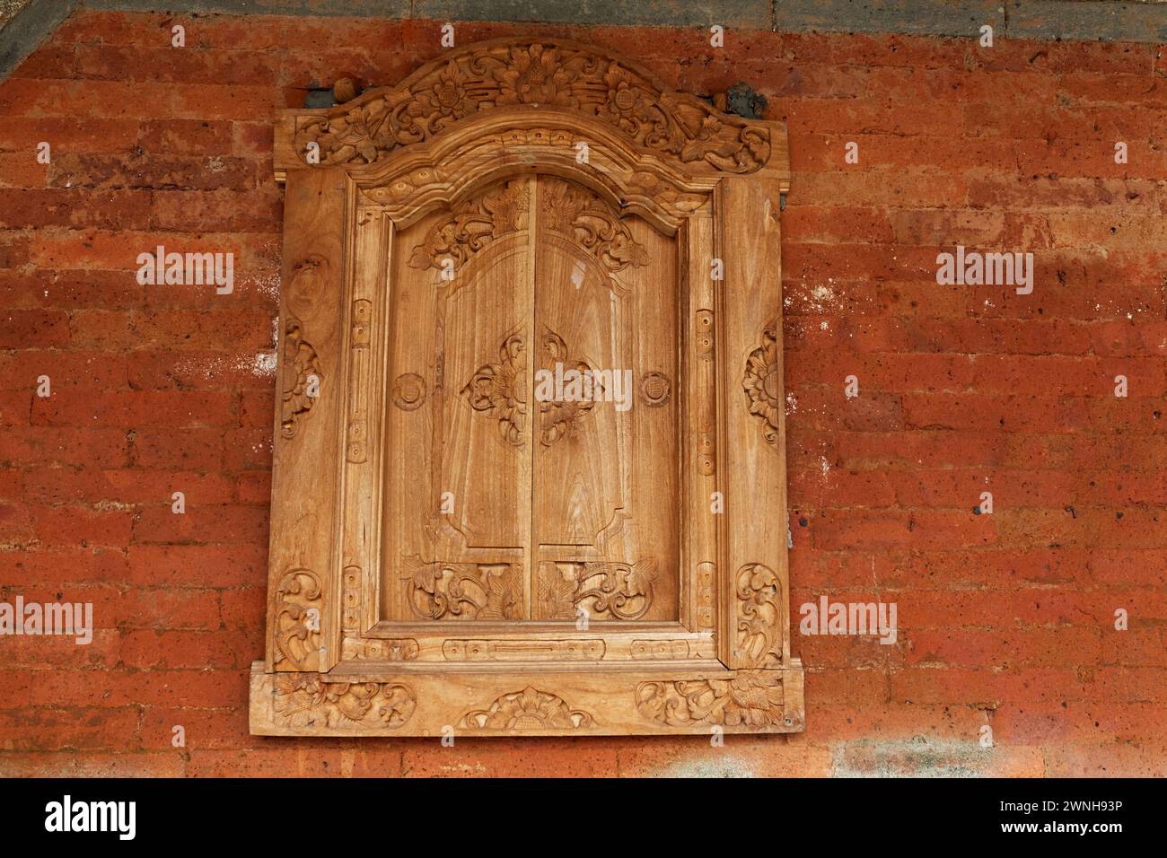 Homemade wooden sashes on a window in a traditional Balinese house ...