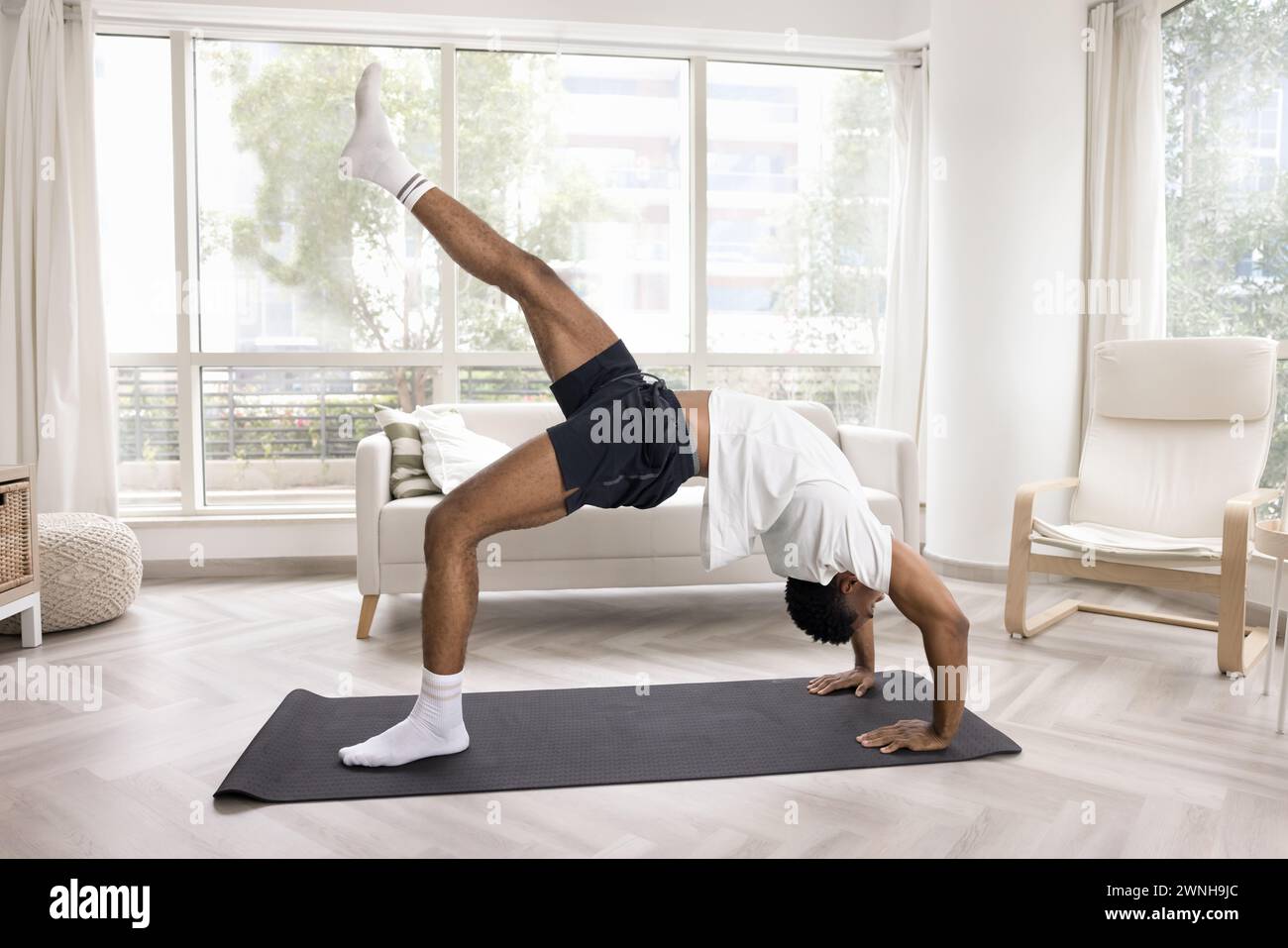 Strong athletic young African man doing bridge stand Stock Photo - Alamy