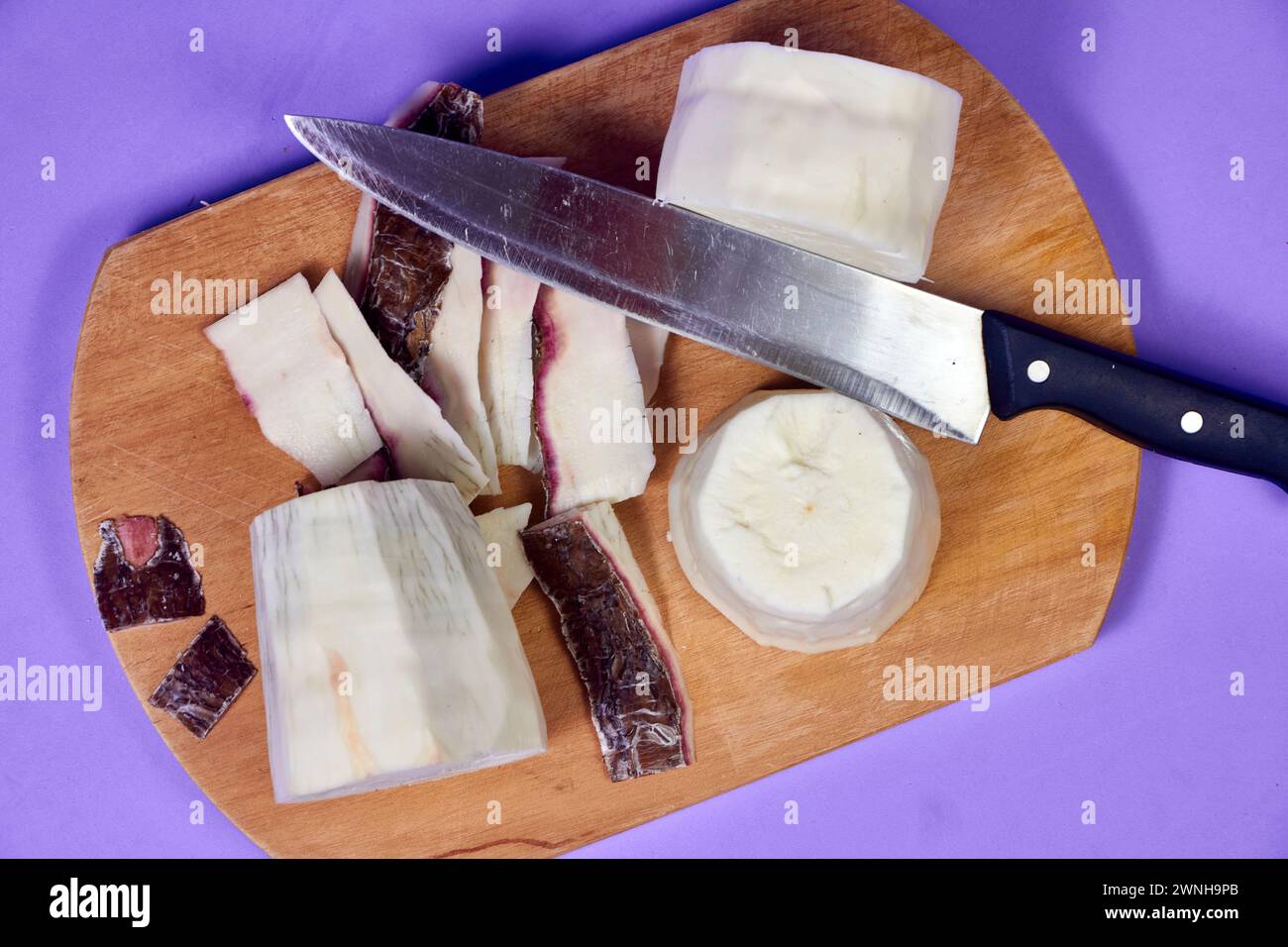 Fresh Organic Cassava Root, Manioc Esculenta, yuca On purple Background ...
