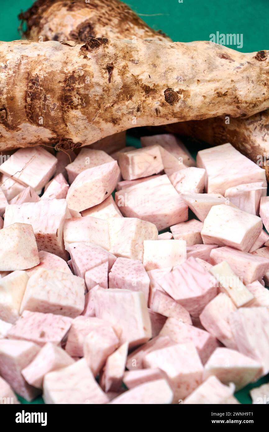 closeup of taro root vegetable, eddo malanga, green background Stock ...
