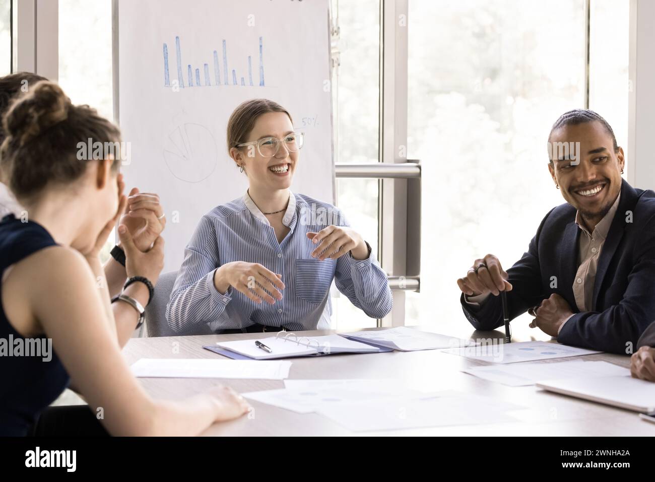 Happy multiethnic teammates laughing hi-res stock photography and ...