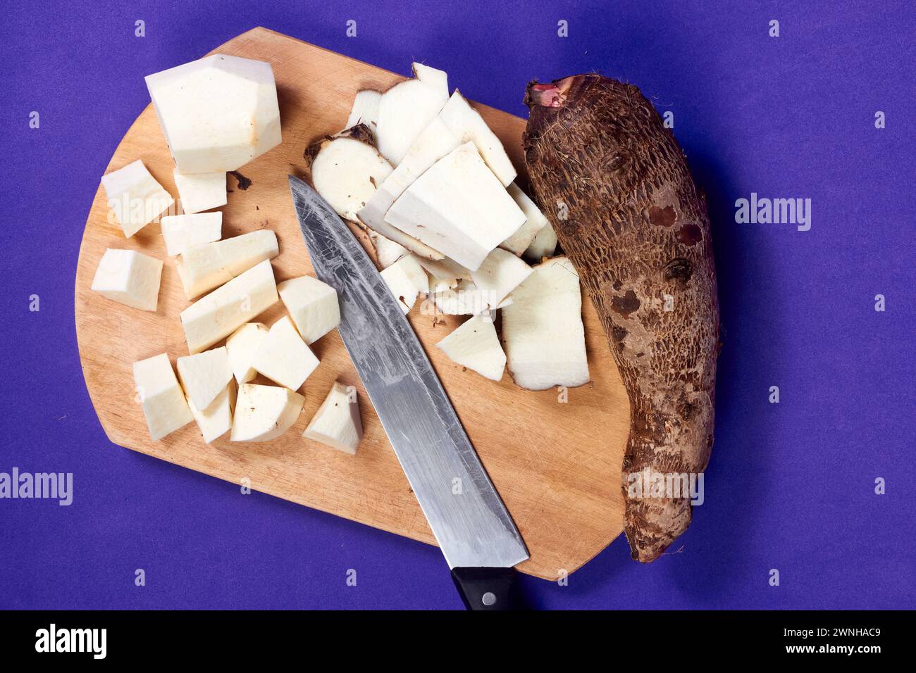 closeup of taro root vegetable, eddo malanga, purple background Stock ...
