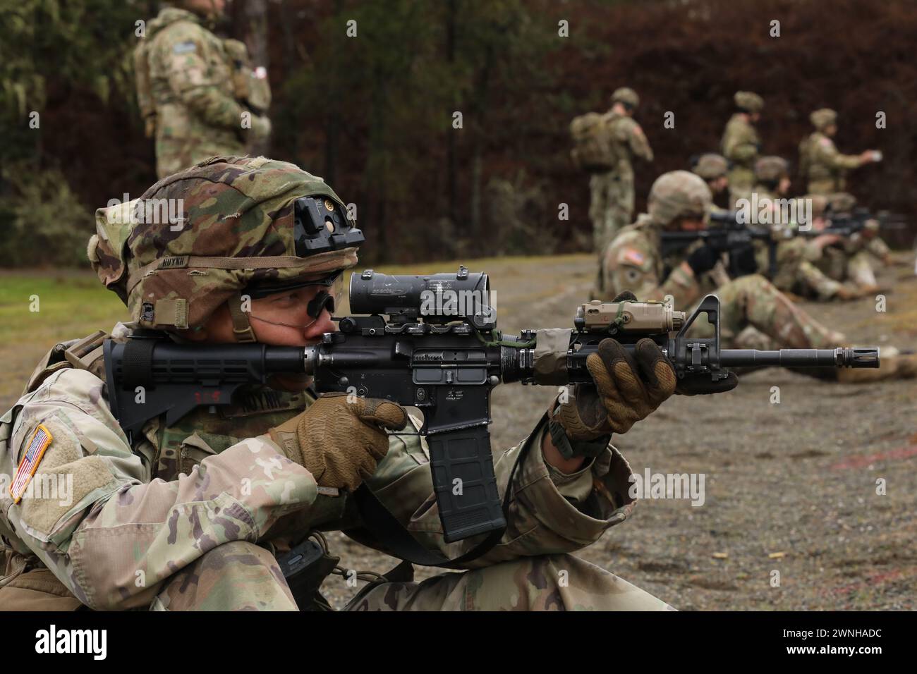 A U.S. Army Soldier prepares to clear his weapon after participating in ...