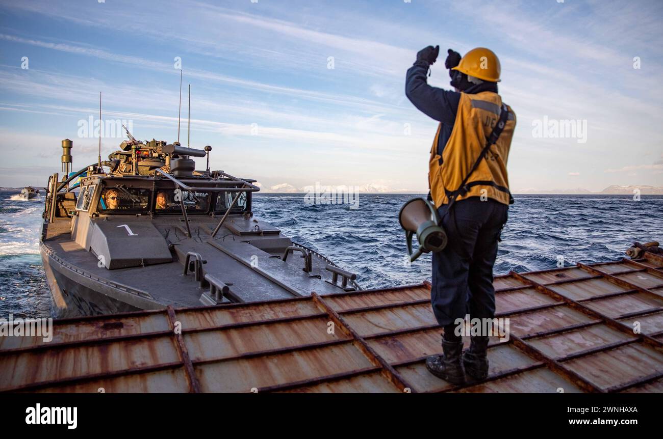 Boatswain’s Mate 3rd Class Hadassah King signals to Swedish Marines ...