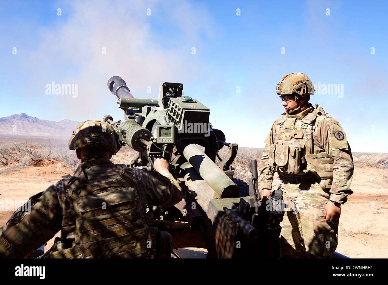 U.S. Army Soldiers of Bravo Battery, 3rd Battalion, 112th Field Artillery Regiment, 44th ...