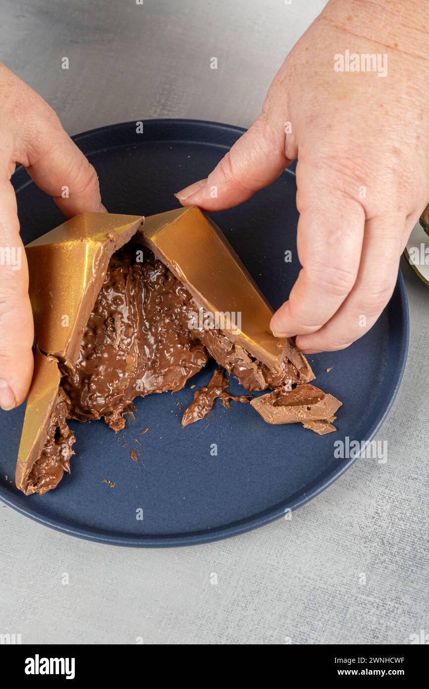 Belgian milk chocolate Easter egg in golden front shape 14 Stock Photo ...
