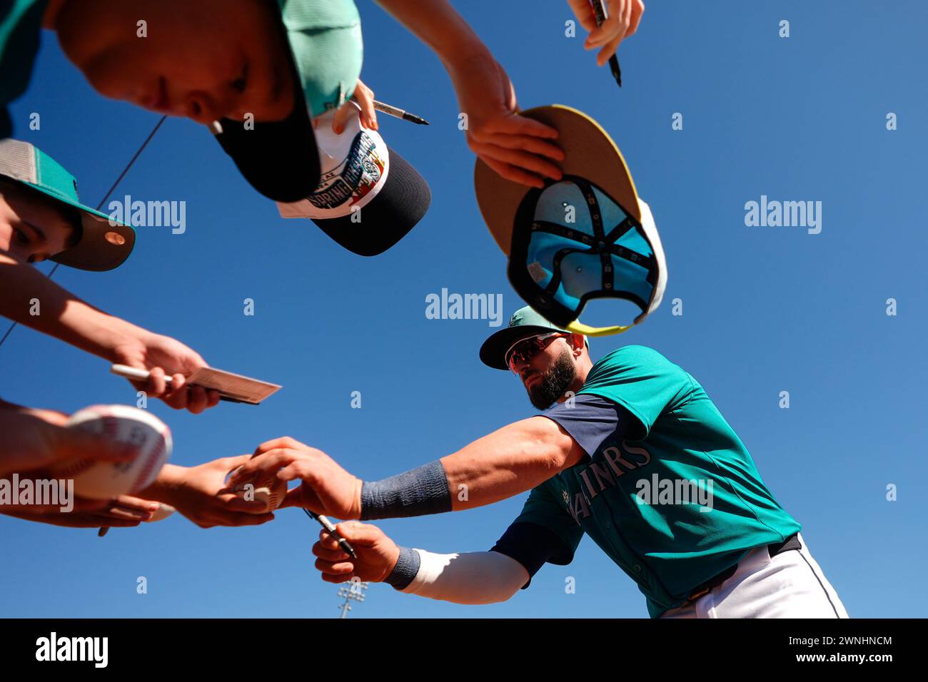Seattle Mariners right fielder Mitch Haniger signs autographs for fans ...