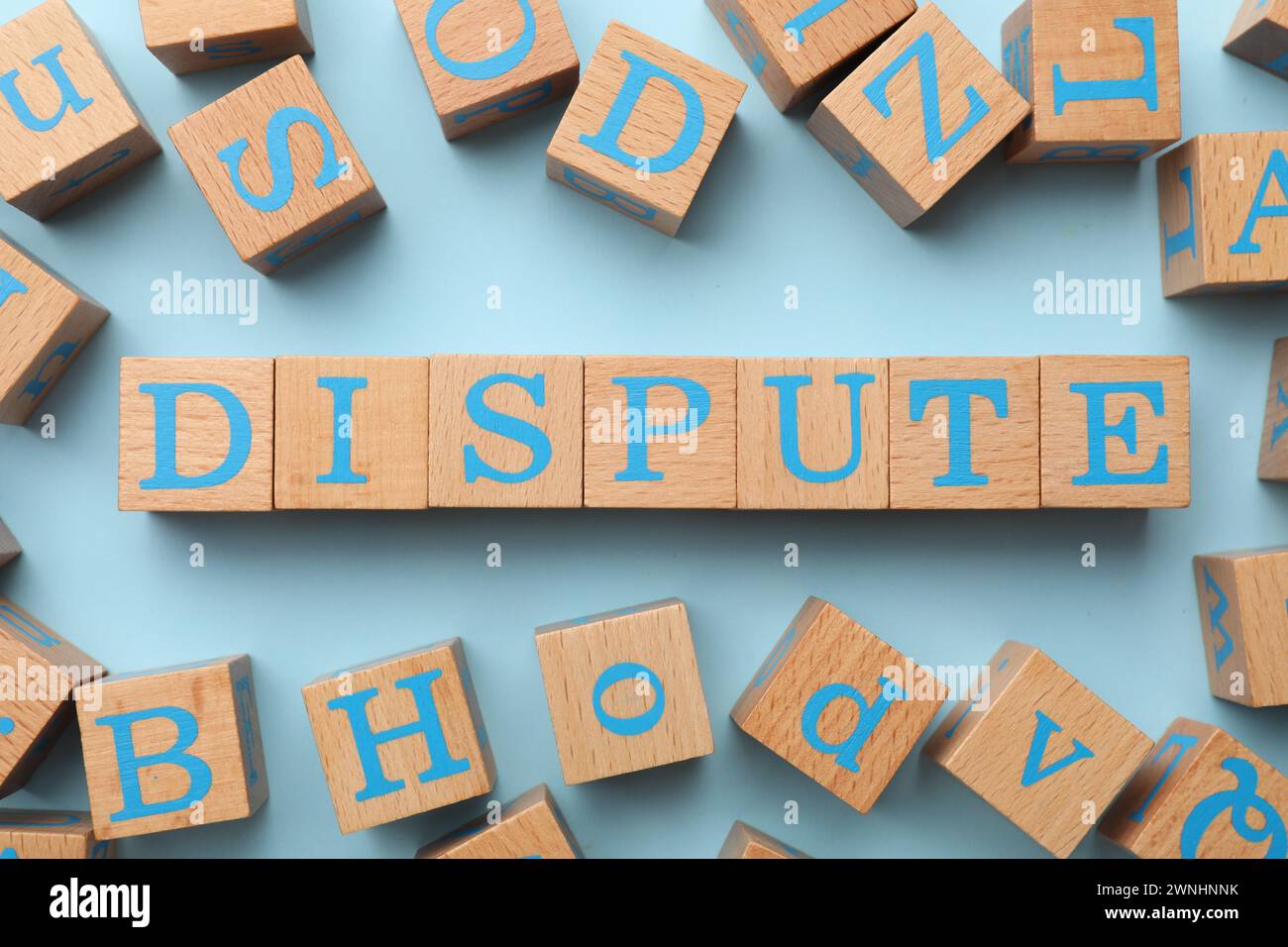 Cubes with word Dispute on light blue background, flat lay Stock Photo ...