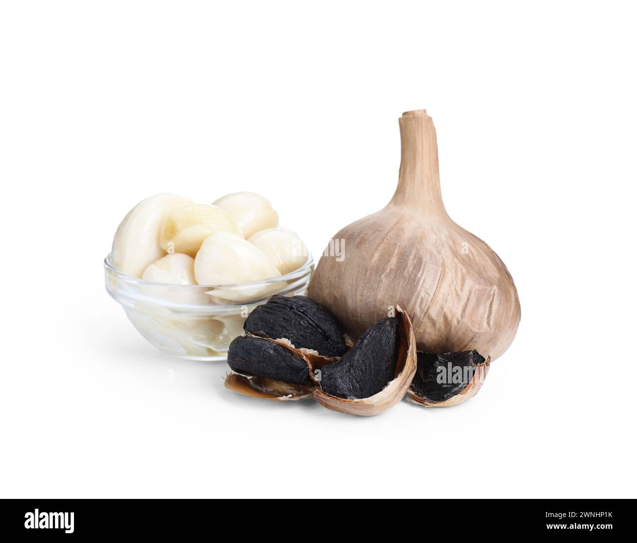 Black fermented garlic on white Cut Out Stock Images & Pictures - Alamy