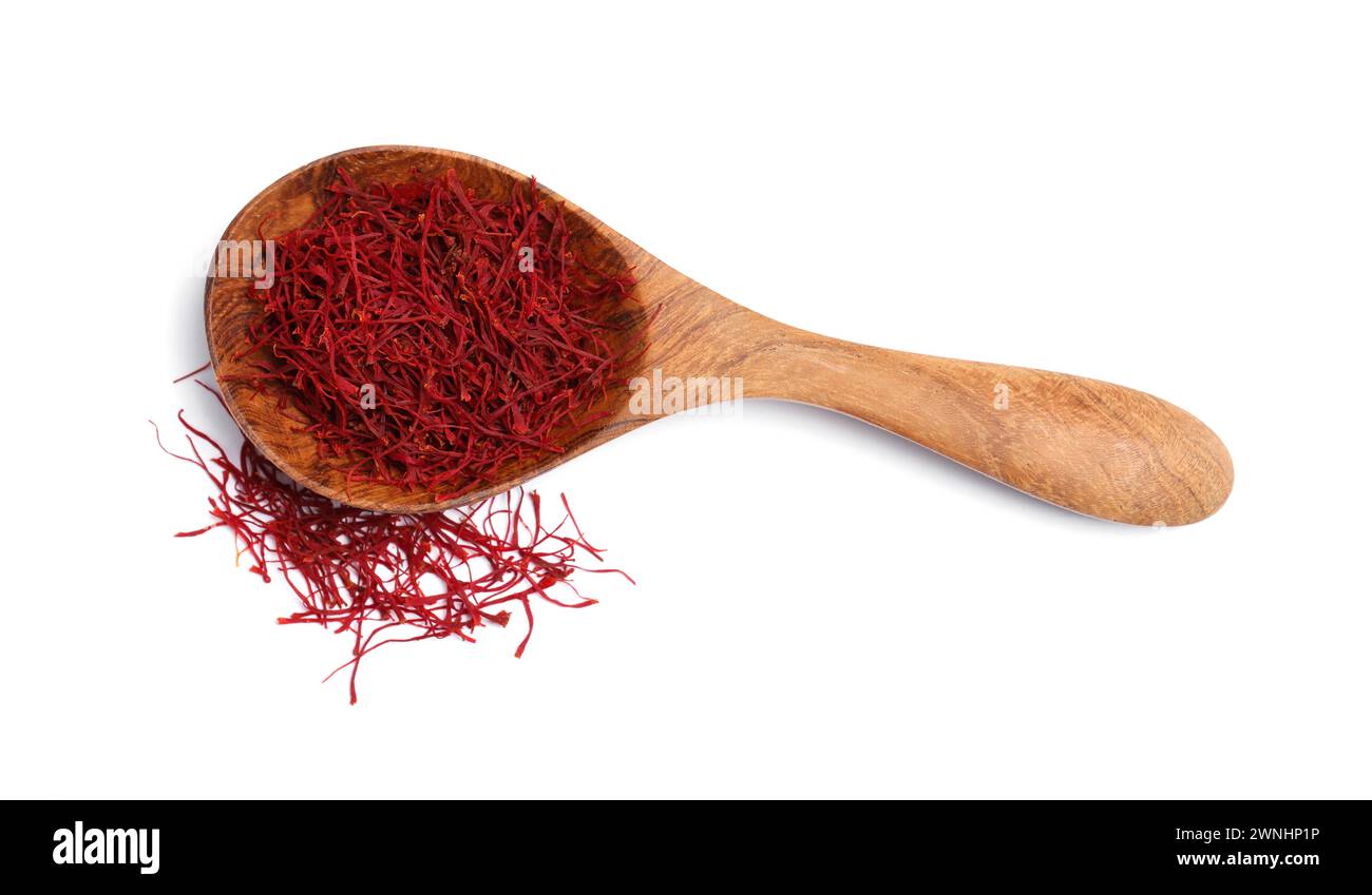 Aromatic saffron and spoon isolated on white, top view Stock Photo - Alamy