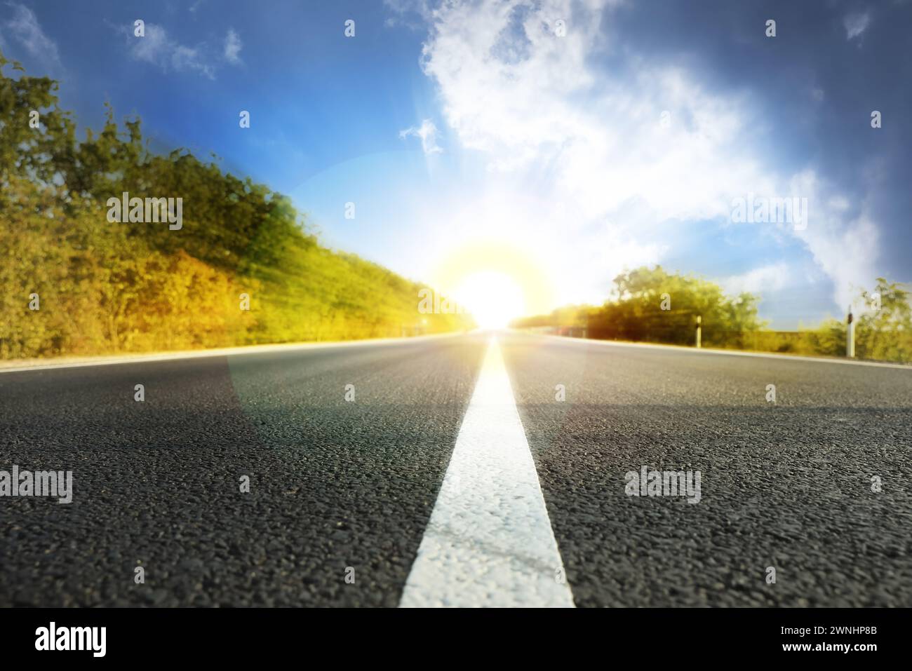 Empty road under sunset sky hi-res stock photography and images - Alamy