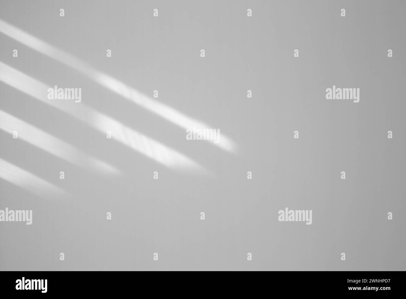 Light and shadows falling on white wall Stock Photo - Alamy