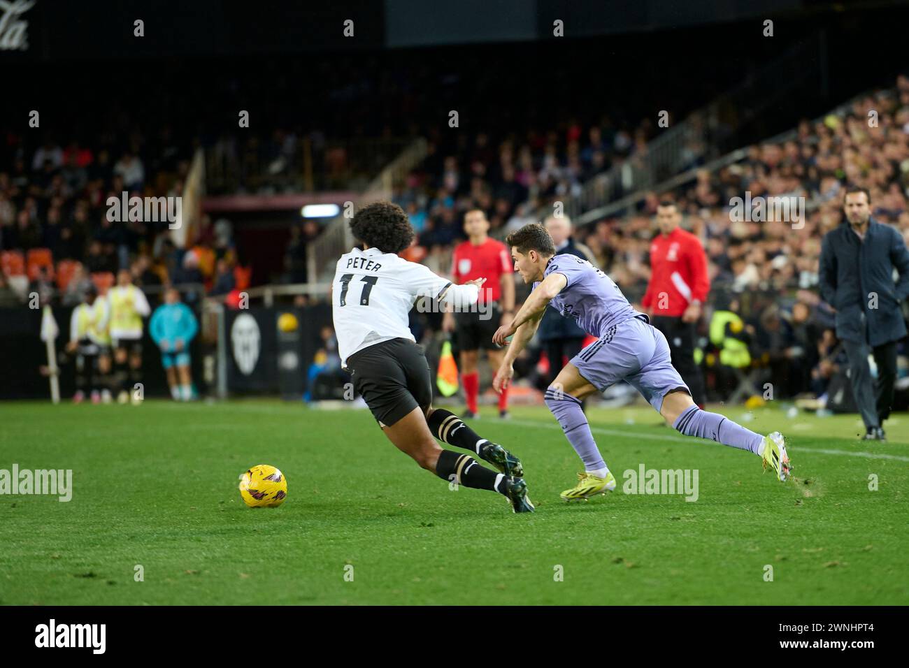 Peter Gonzalez of Valencia CF, Fran Garcia of Real Madrid in action ...