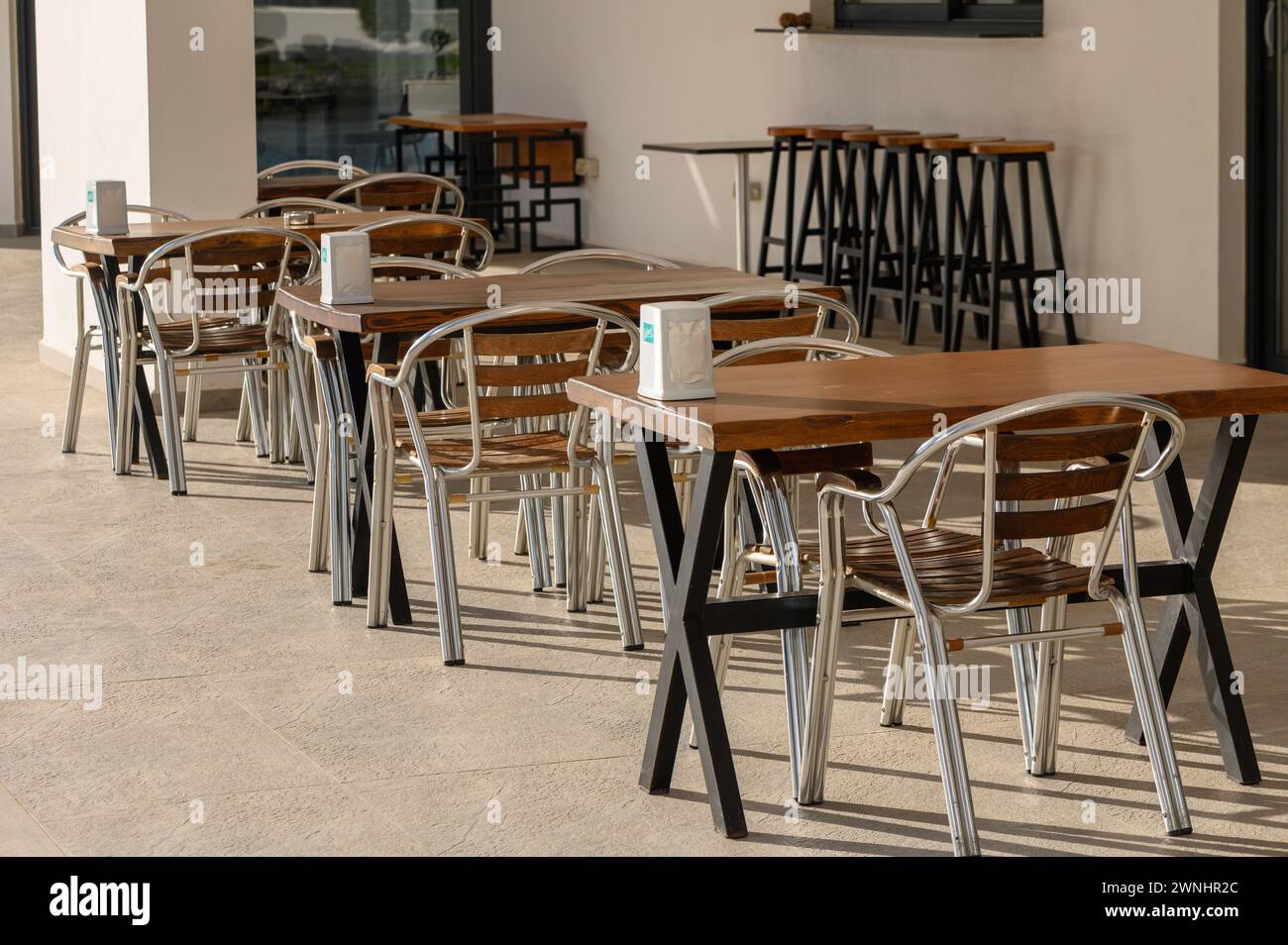tables in a cafe and swimming pool in a residential complex Stock Photo ...
