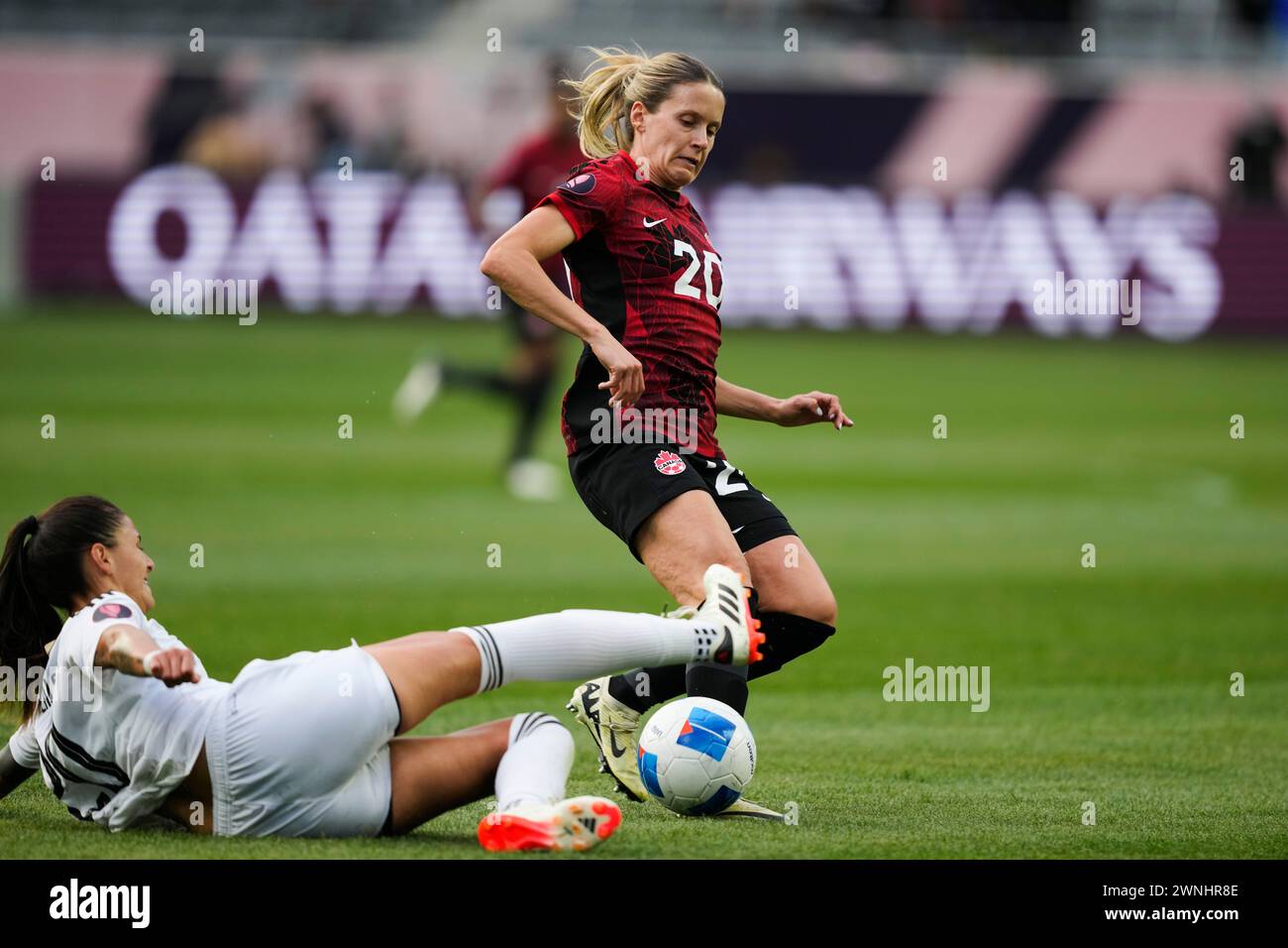 Costa Rica defender Fabiola Villalobos, left, slide-tackles Canada ...