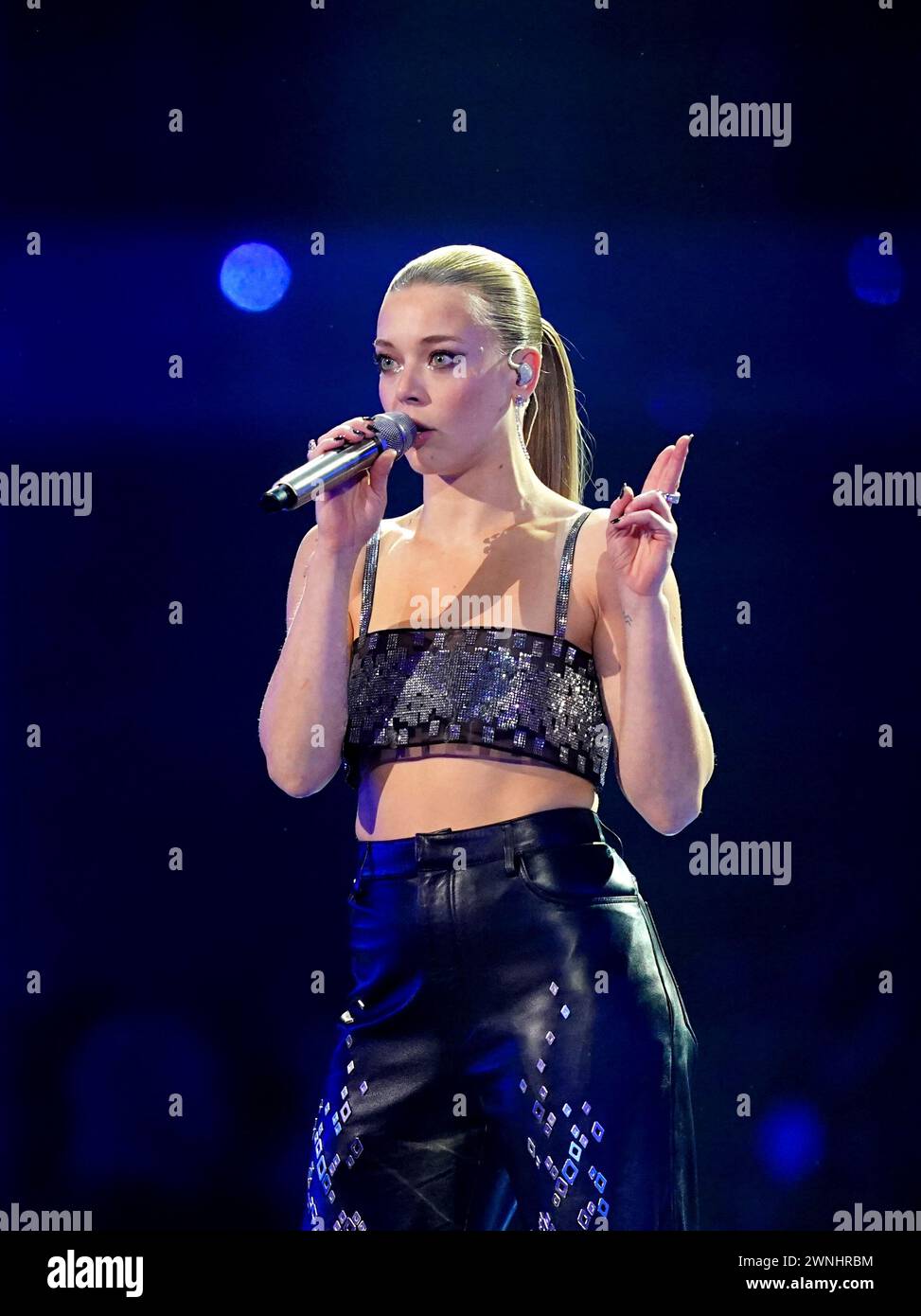 Becky Hill performing on stage during the Brit Awards 2024 at the O2 ...