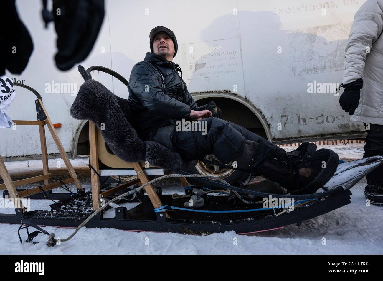 Veteran musher Matthew Failor talks with mushing fans as he prepares ...