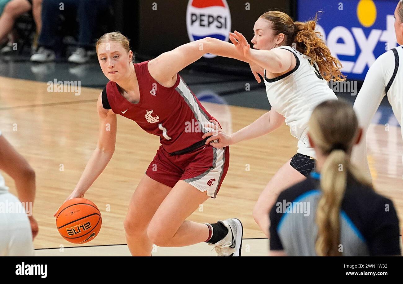Washington State guard Tara Wallack (1) drives past Colorado guard ...